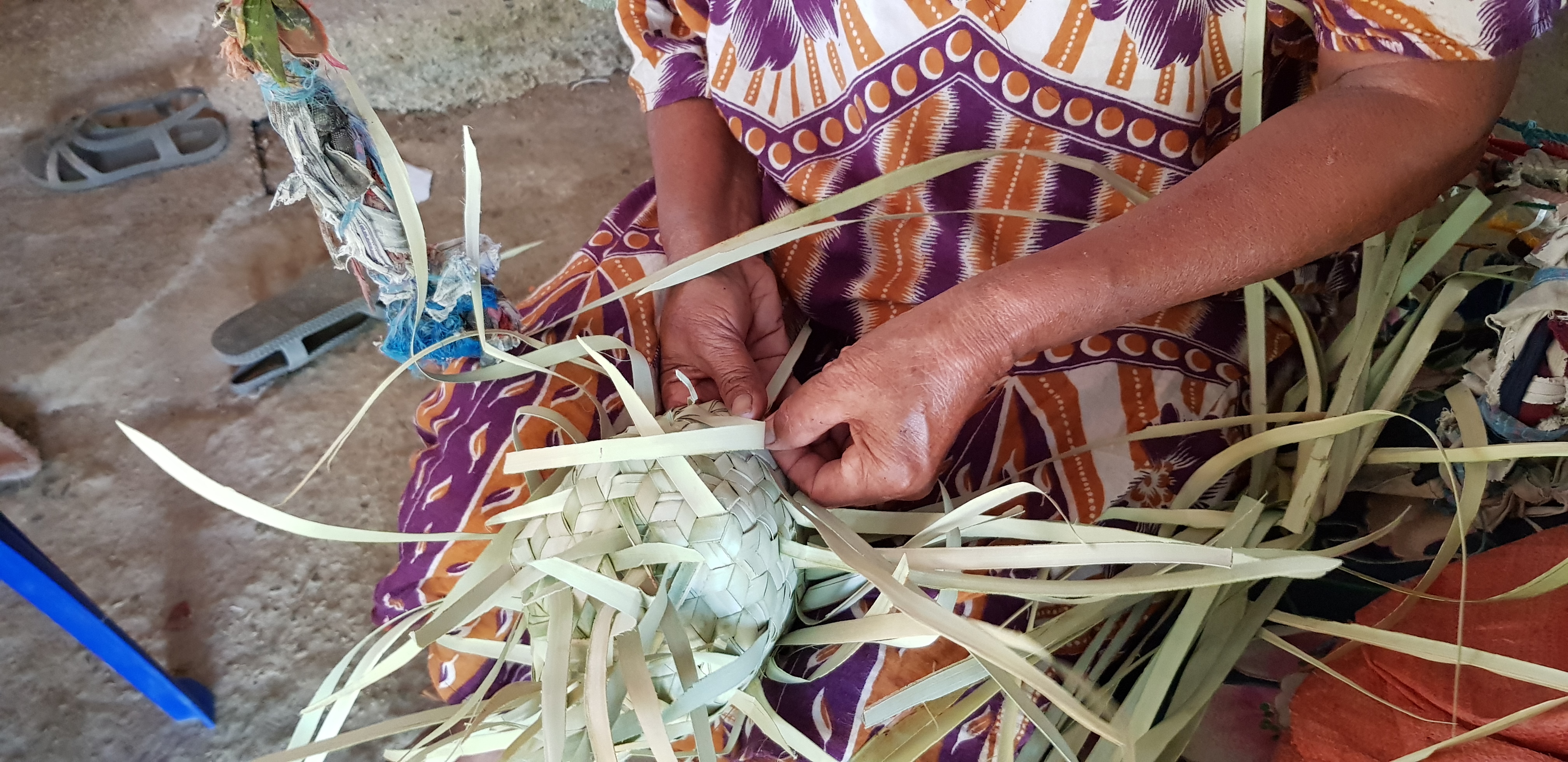 woman's making handicraft from lontar - New Mandala