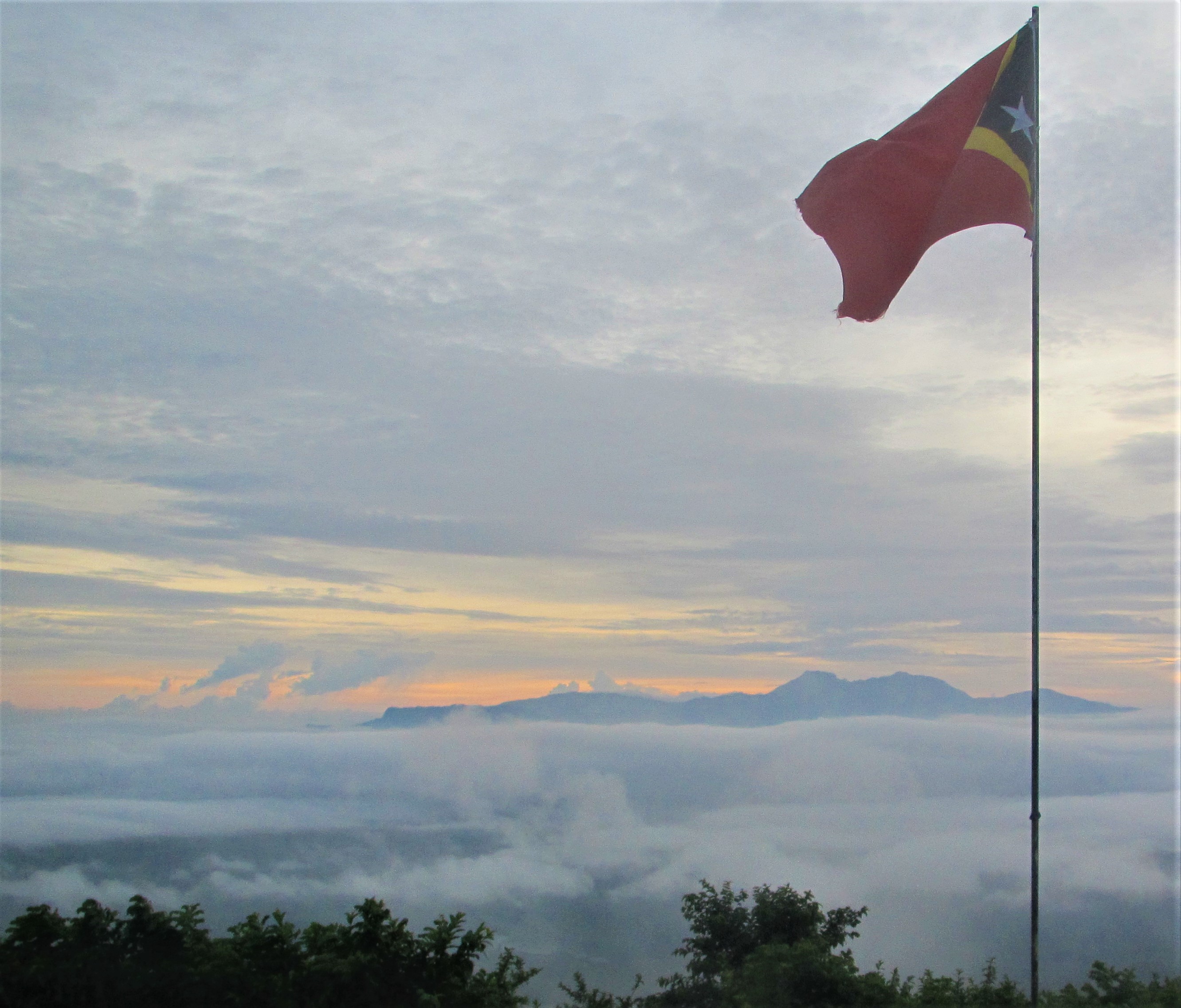 TL flag over hills - New Mandala