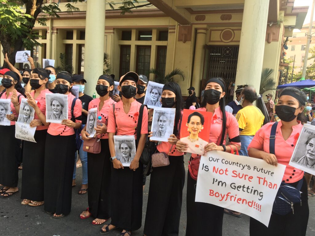14. Staff from local businesses appear at protests in uniform - New Mandala